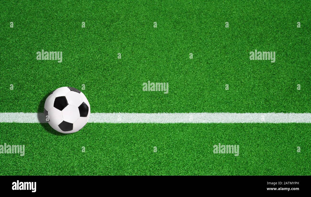 ball on the green field in soccer stadium Stock Photo - Alamy