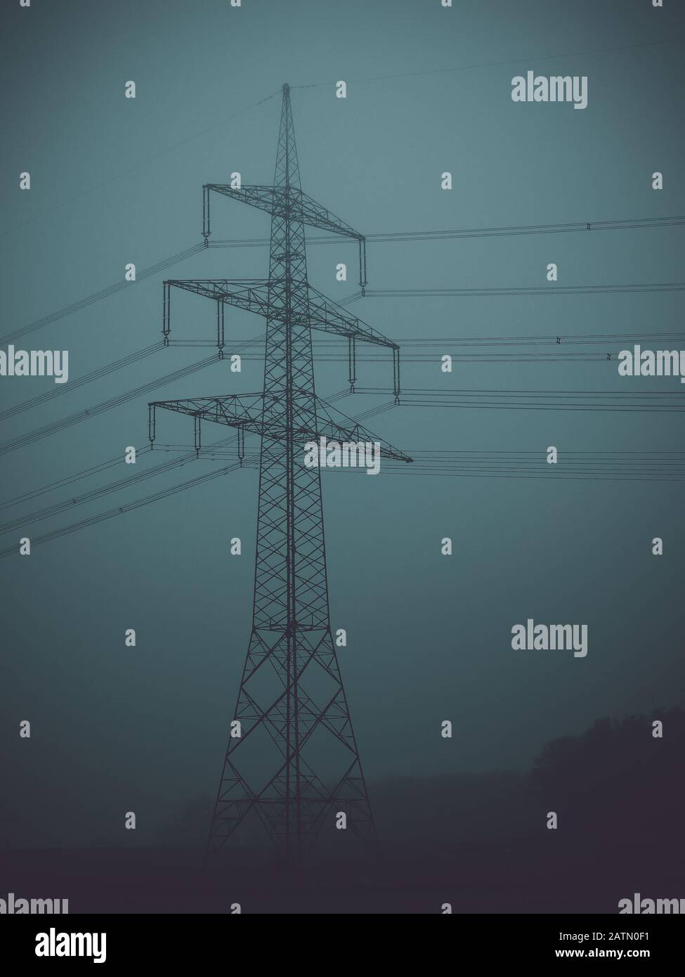 Big power pylon by night Stock Photo - Alamy