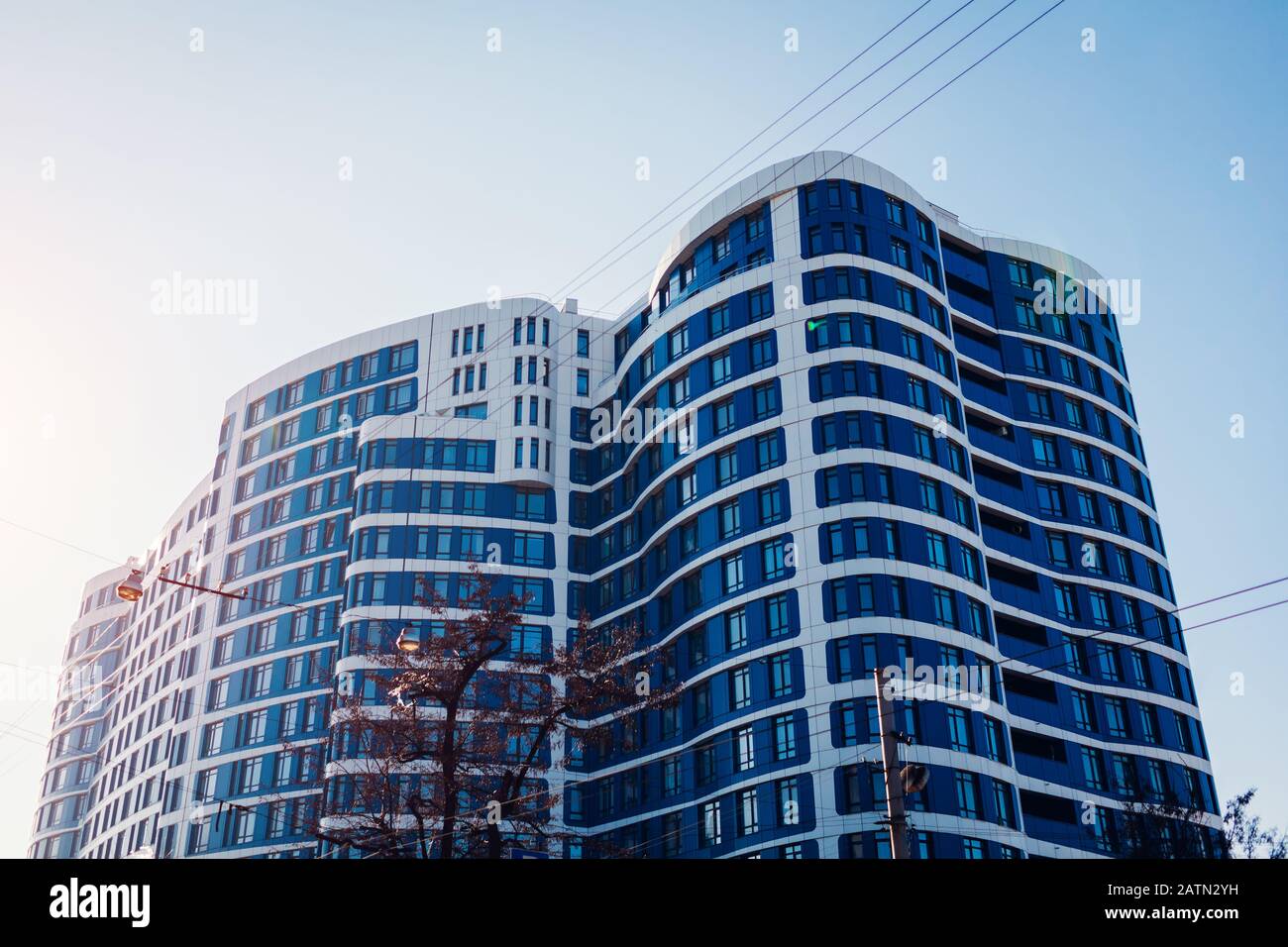 New multistorey residential round building. Modern house of blue and ...