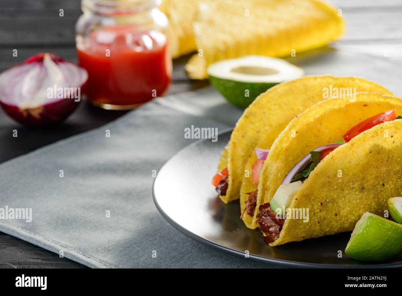 Homemade hard-shell tacos. Ingredients on a table Stock Photo - Alamy