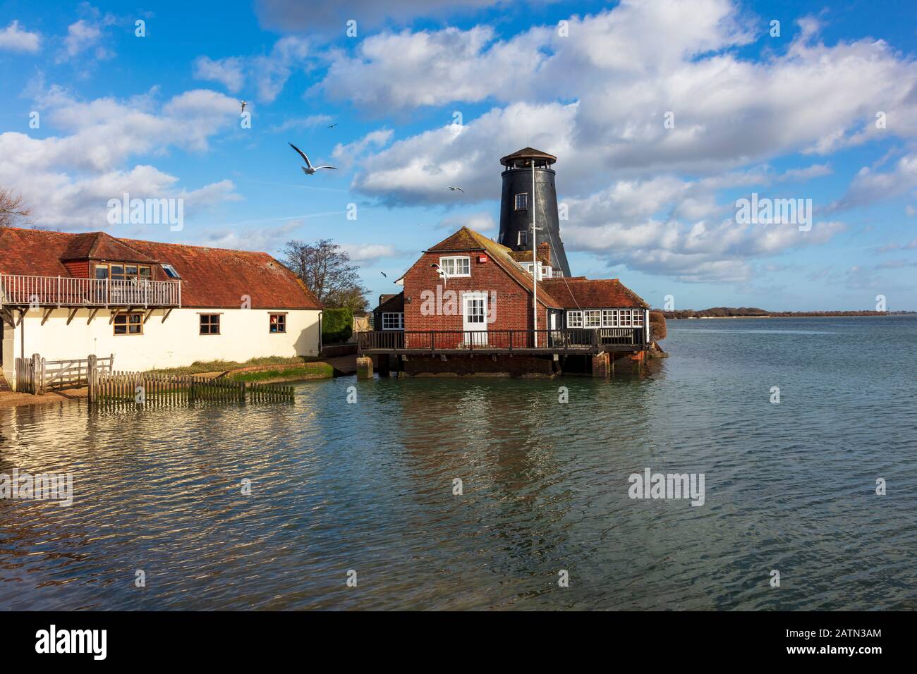 The mill at Langstone on the Solent Way footpath at high tide in ...