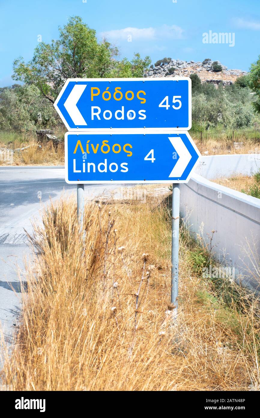Blue traffic sign with directions to Rhodes town and Lindos (Rhodes ...