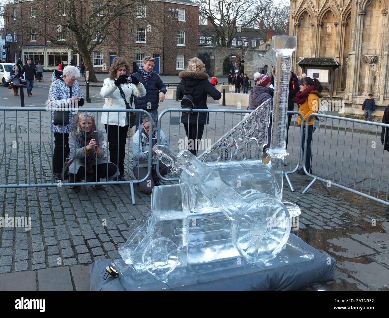 People viewing an intricate ice sculpture in the shape of a Stephenson ...