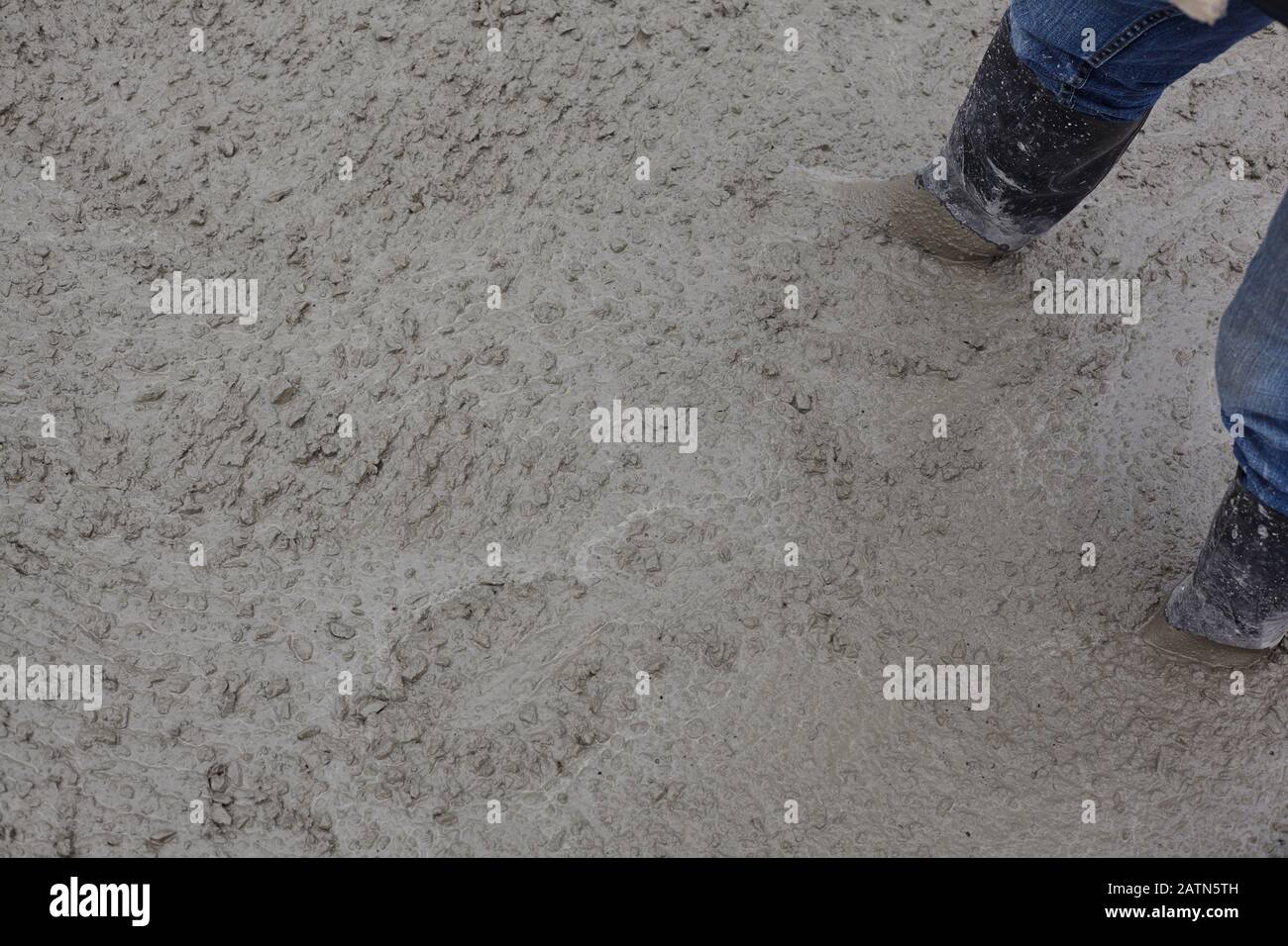 worker puts concrete on the ground Stock Photo - Alamy