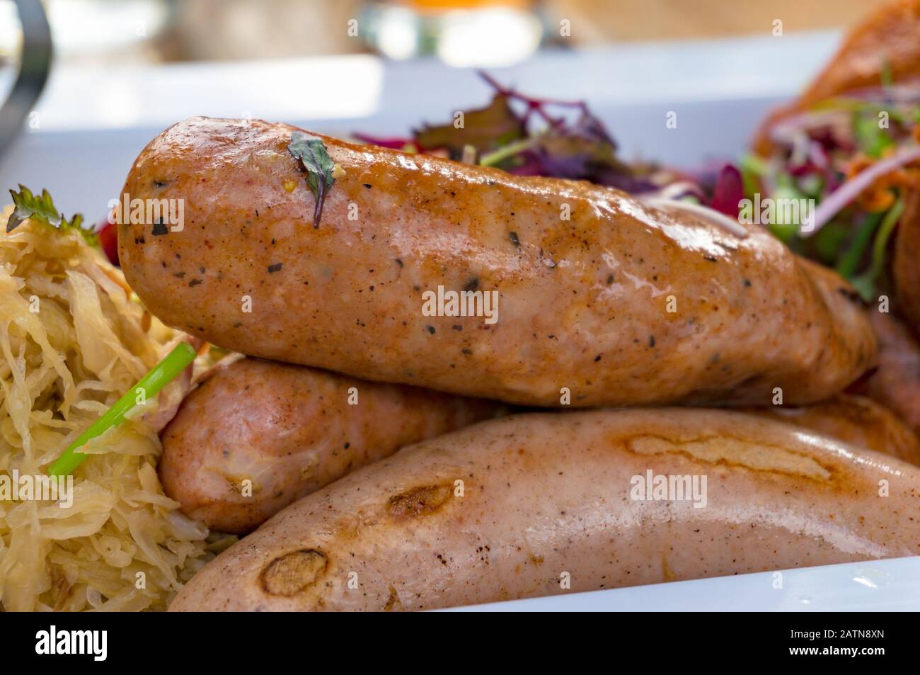 German sausages with sauerkraut, cabbage meal. Food background Stock ...