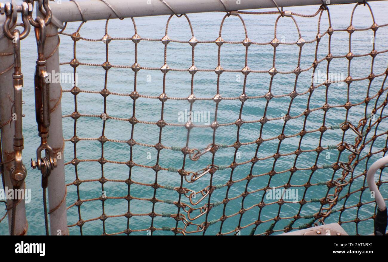 Net protecting the sides of a boat Stock Photo - Alamy