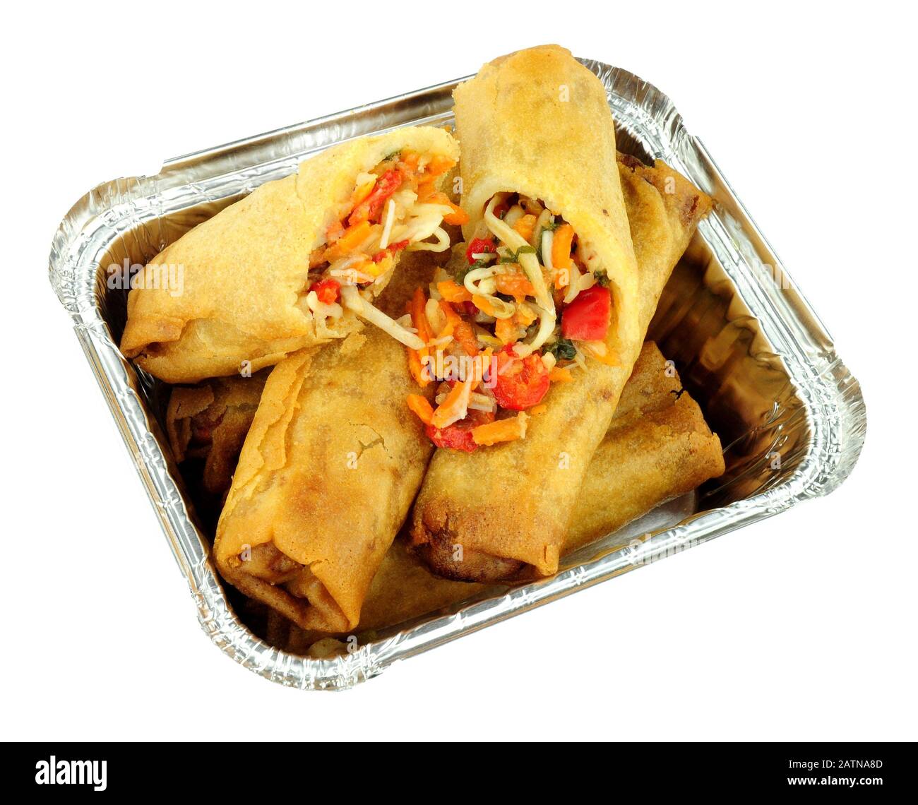 Chinese crispy vegetable filled spring rolls in an aluminium foil take ...