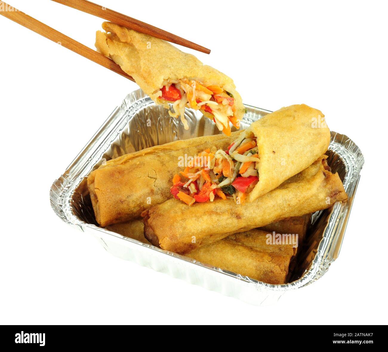 Chinese crispy vegetable filled spring rolls in an aluminium foil take ...