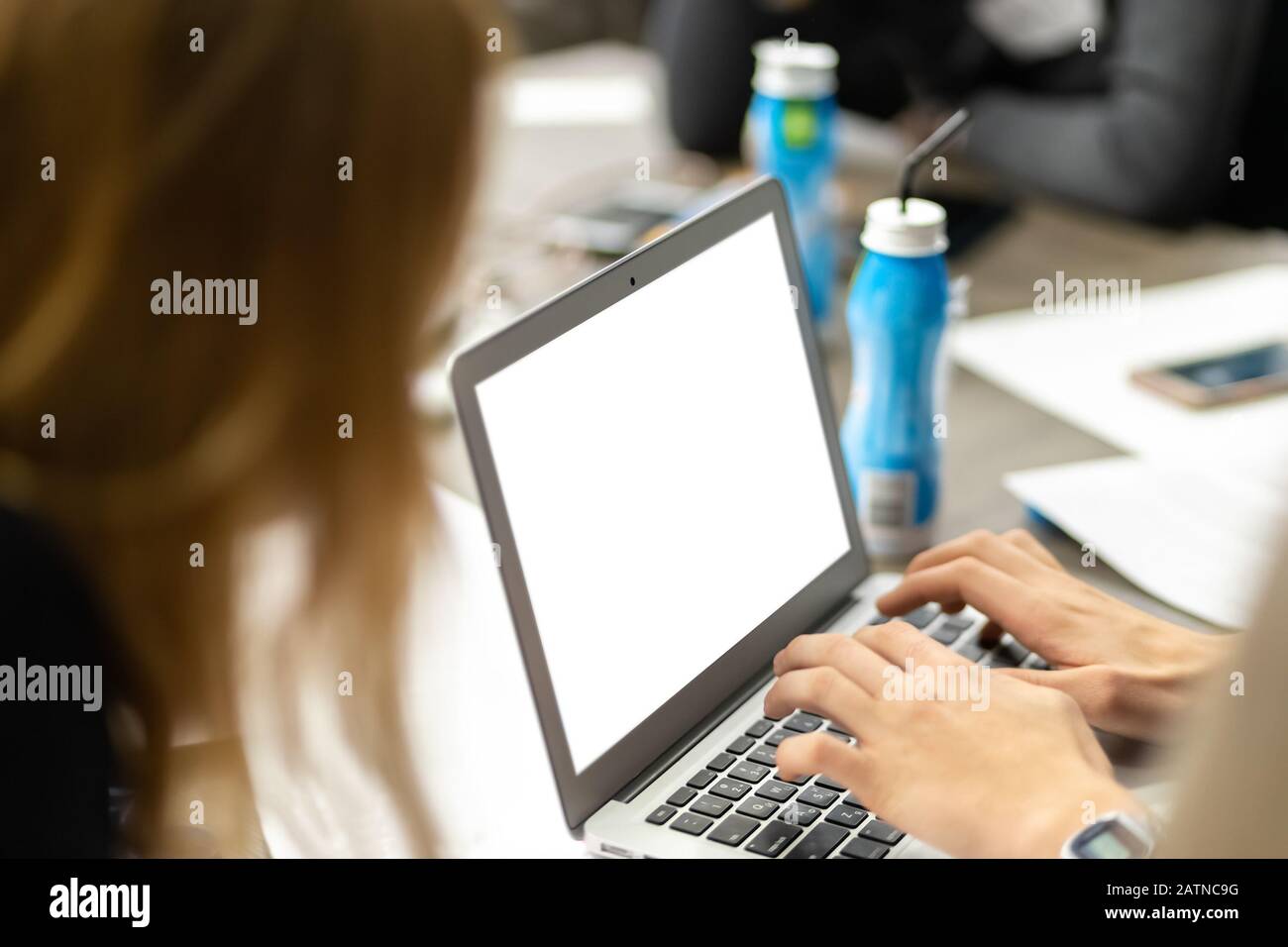 Typing on laptop. Team work. Blank screen for mock up Stock Photo - Alamy