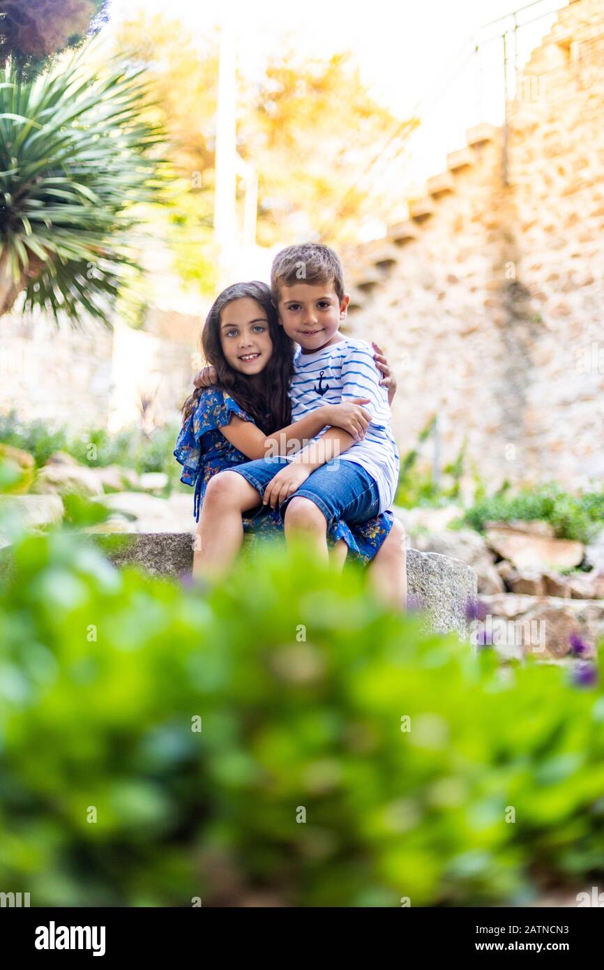Portrait of two cute kids in a summer day Stock Photo - Alamy