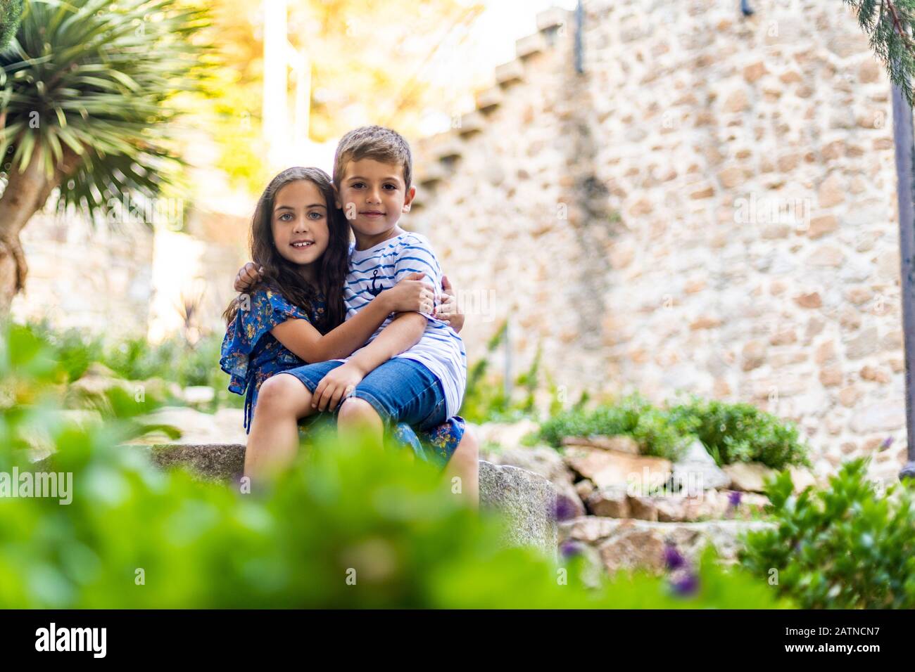 Portrait of two cute kids in a summer day Stock Photo - Alamy