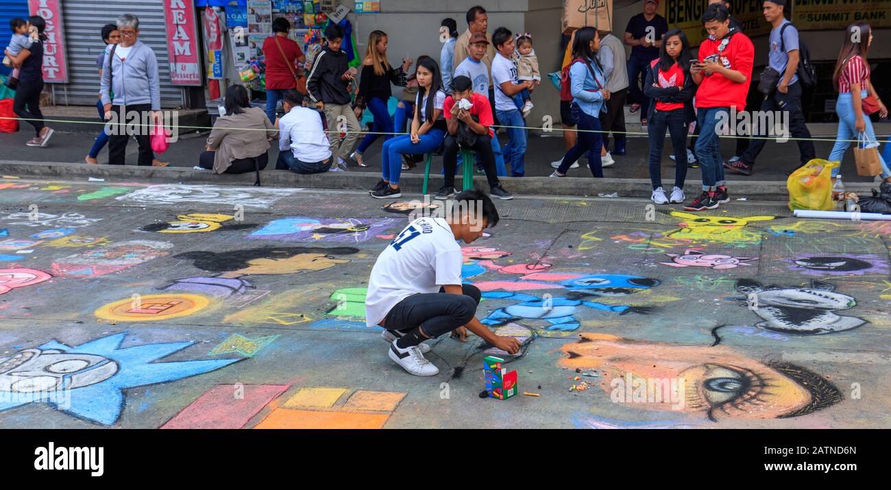 Baguio, Philippines - December 22, 2019: A Young Man Drawing on the ...