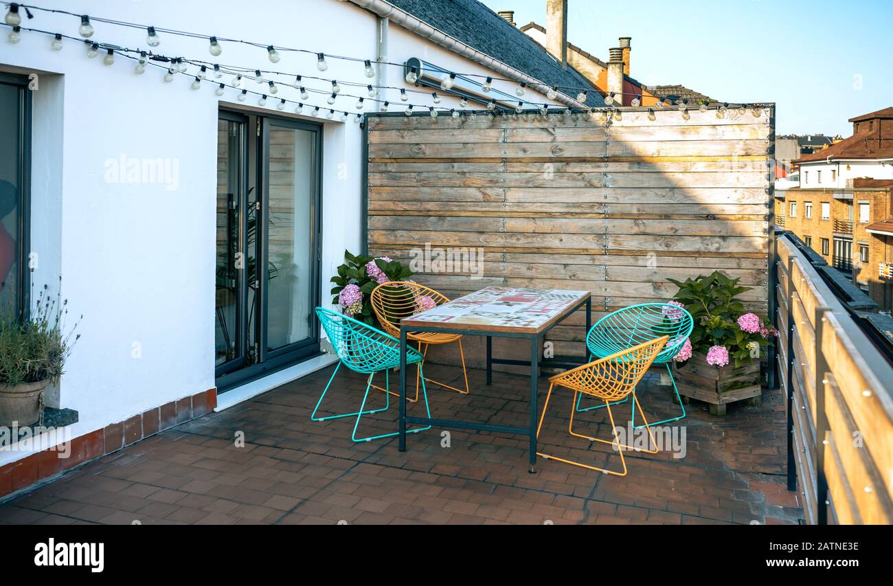 Terrace with table and chairs Stock Photo - Alamy