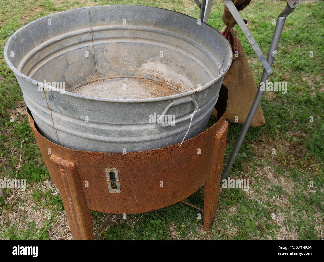 Old rin pail in a rusty stand sold at a flea market Stock Photo - Alamy