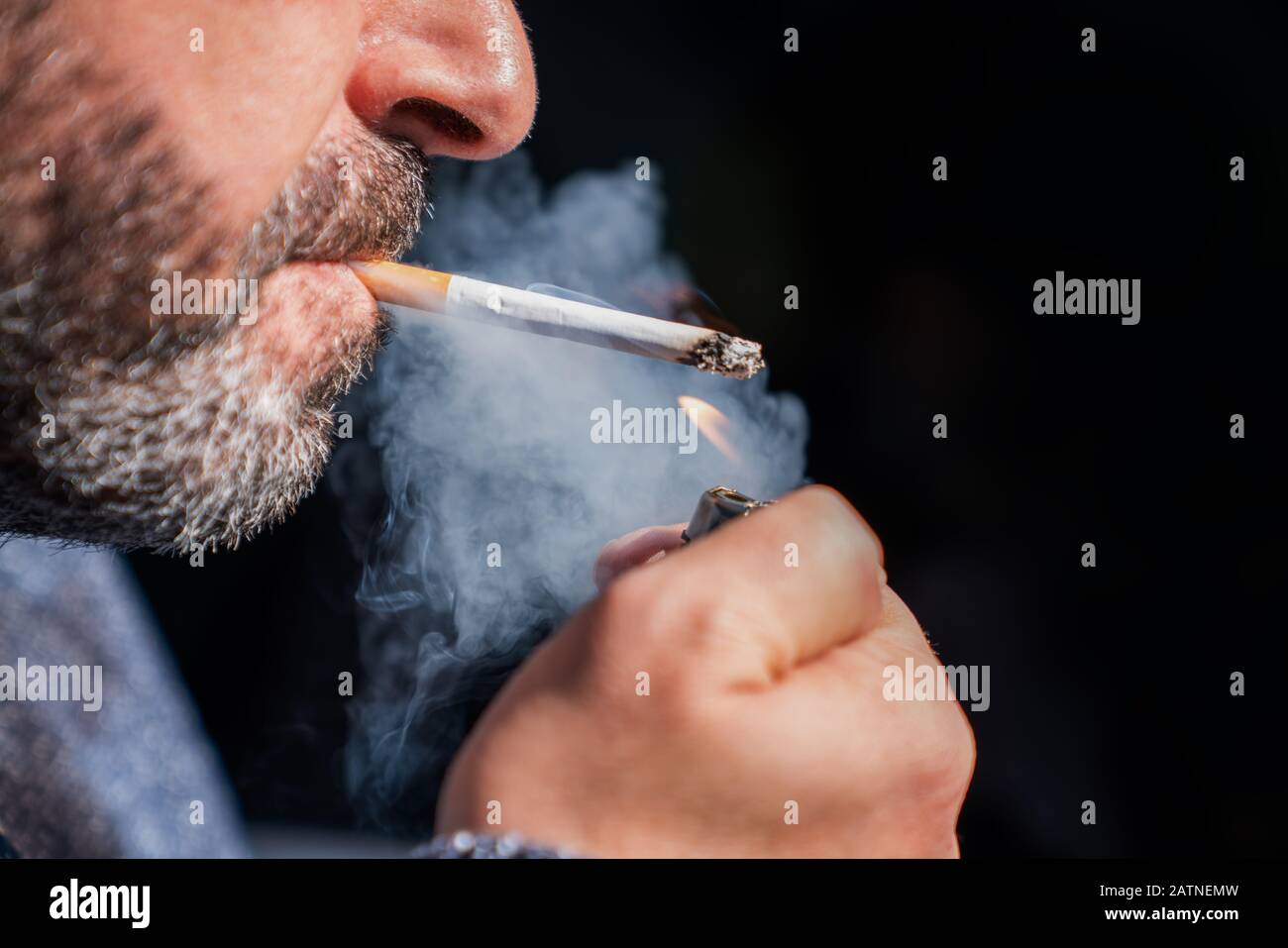 Person holding a cigarette hi-res stock photography and images - Alamy