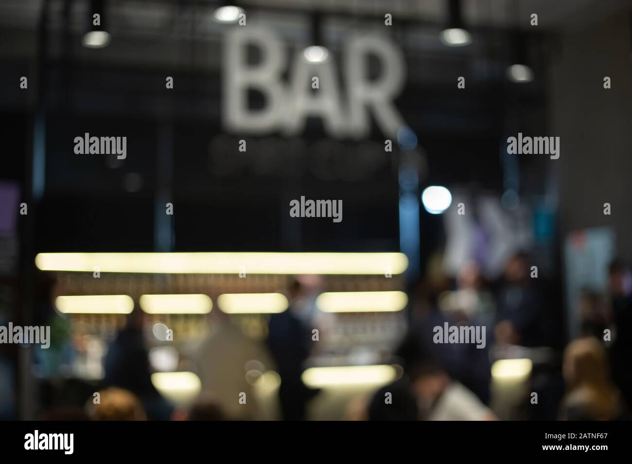 Defocused glowing bar counter. Blurry party background Stock Photo - Alamy