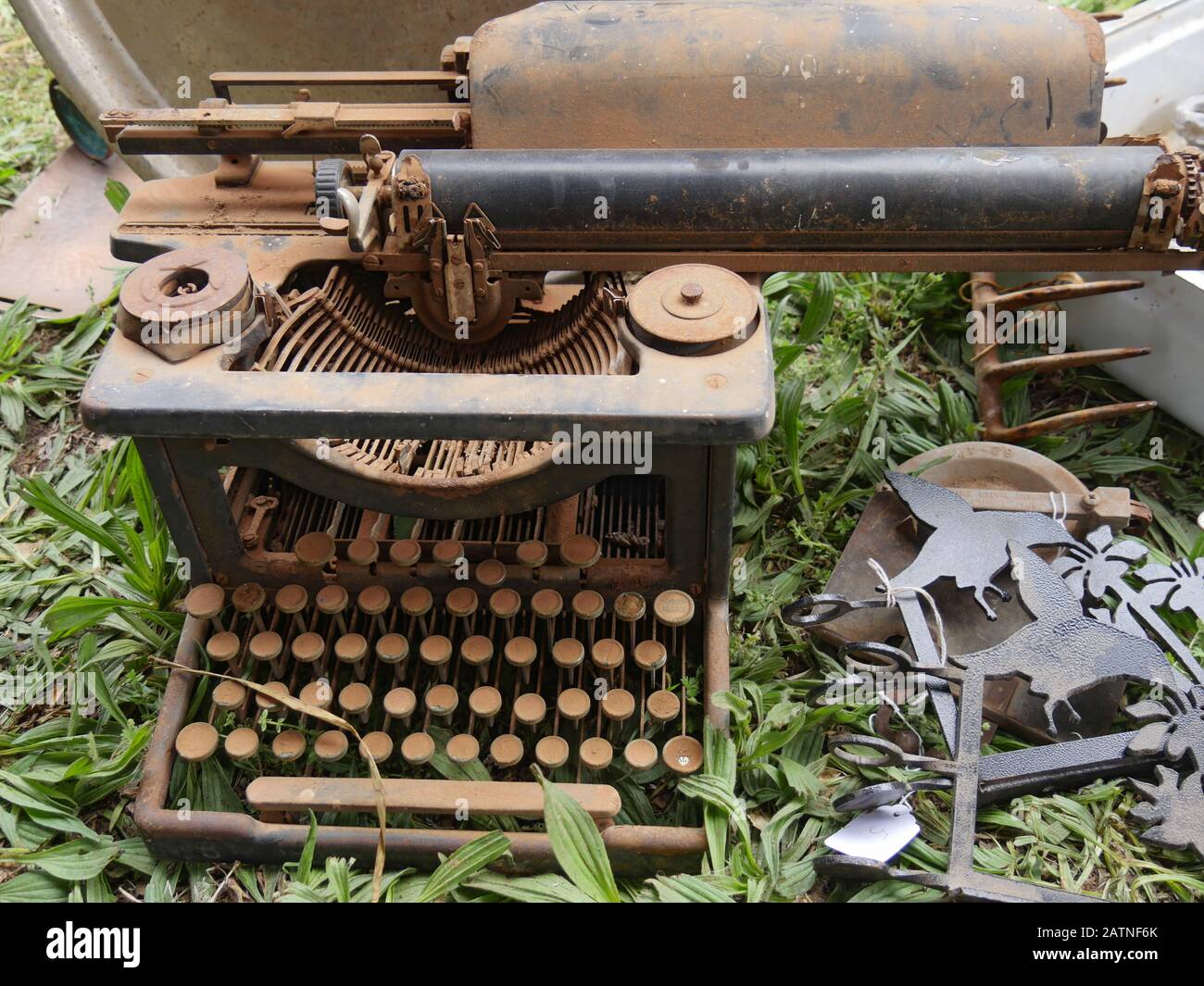 Rusty old typewriter on the ground for sale at a flea market Stock ...