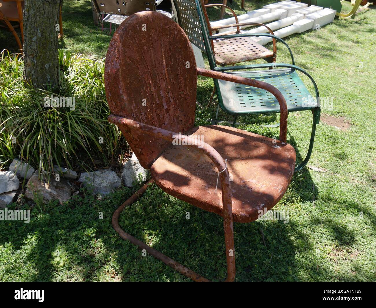 Old rusty garden chair sold at a flea market Stock Photo - Alamy