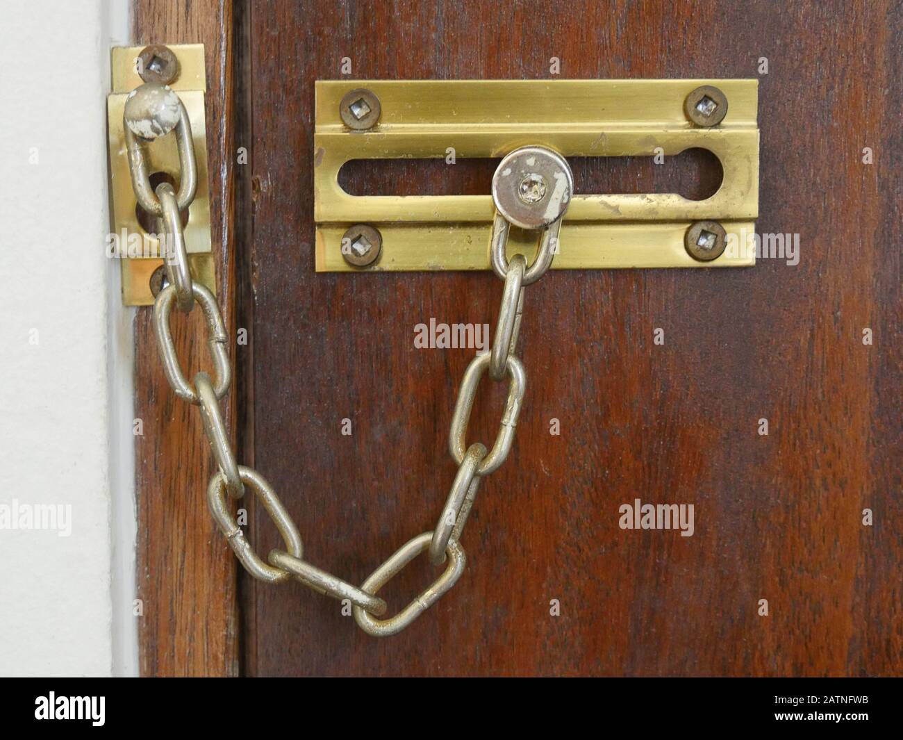 Vintage chainlock in an old hotel room Stock Photo - Alamy