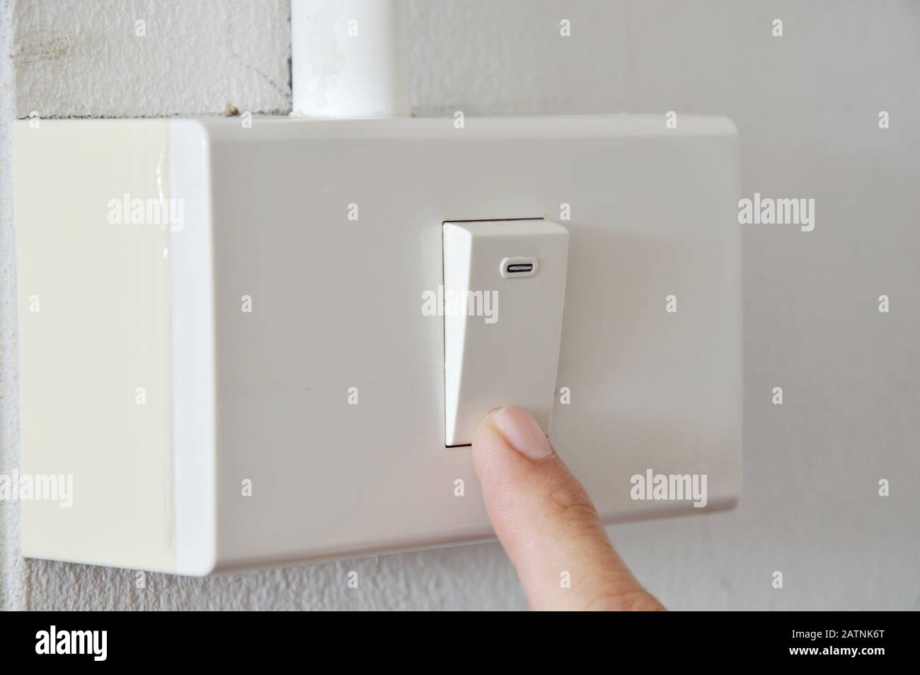 toggle switch in plastic box on the wall Stock Photo - Alamy