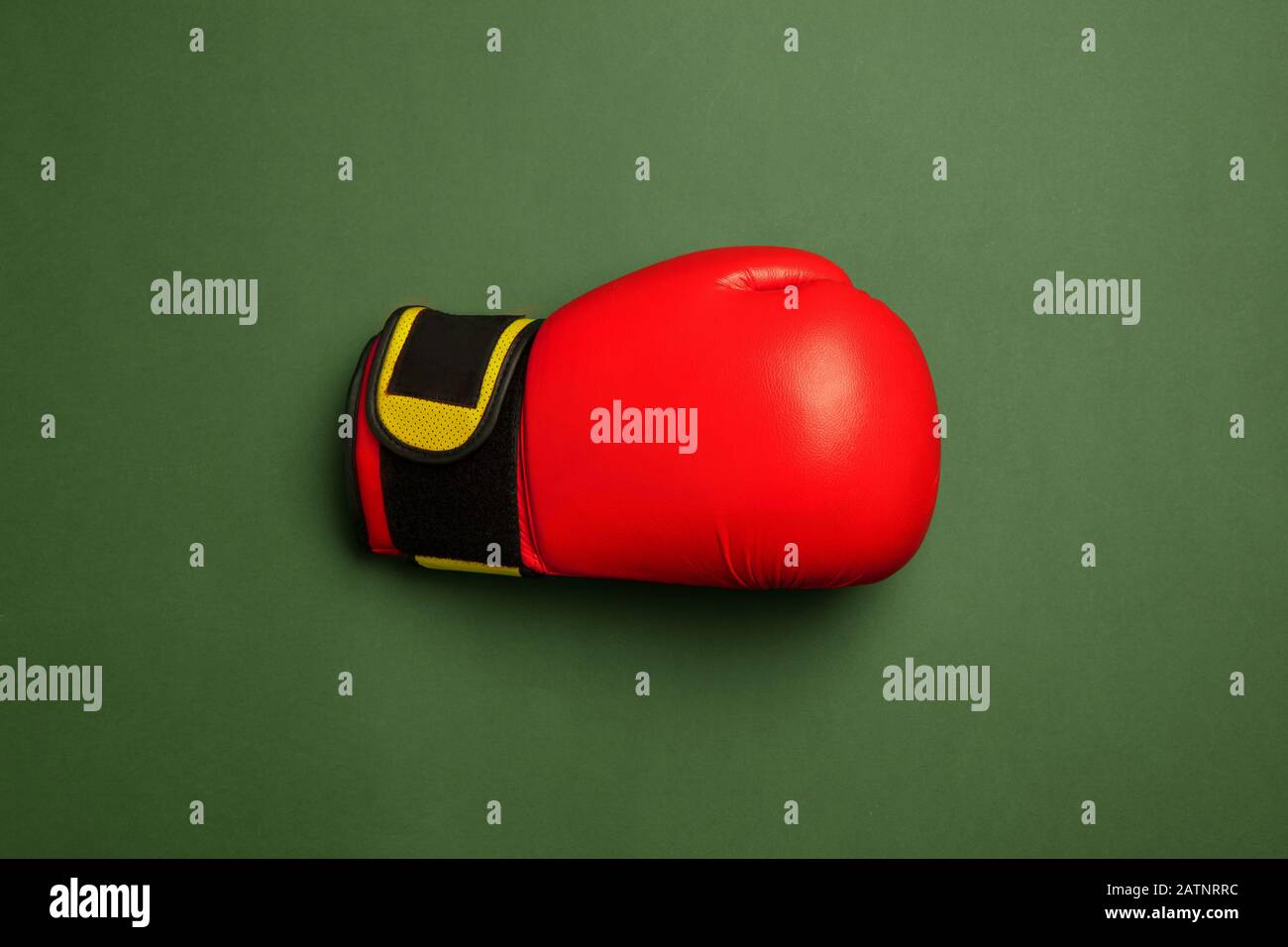 Bright red and yellow boxing glove. Professional sport equipment ...