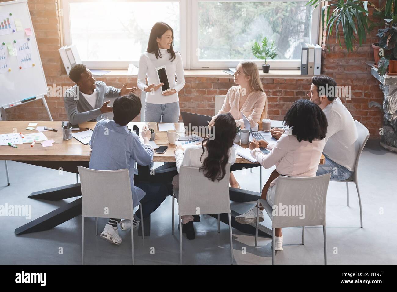 Creative girl making presentation in office, using digital tablet Stock ...