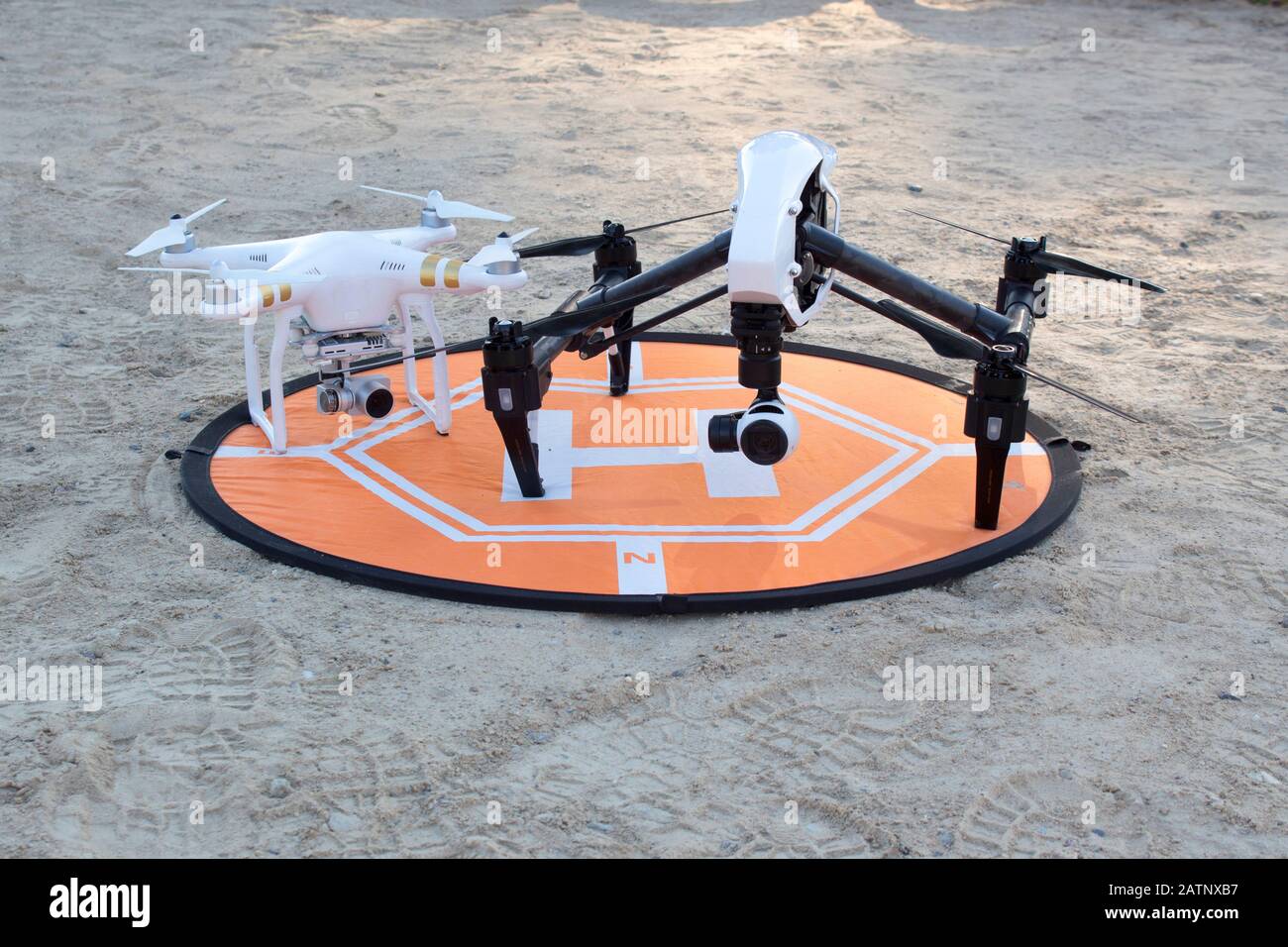 Two drones on a landing strip on the ground Stock Photo - Alamy
