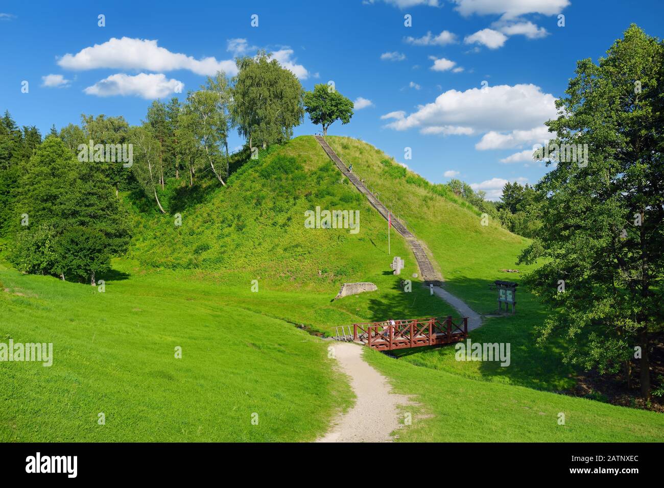Famous Merkine mound with green trees and blue sky background in summer ...