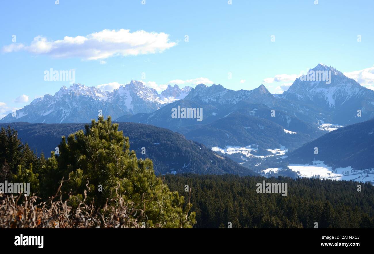 The snow-capped mountains surround the valley Stock Photo - Alamy