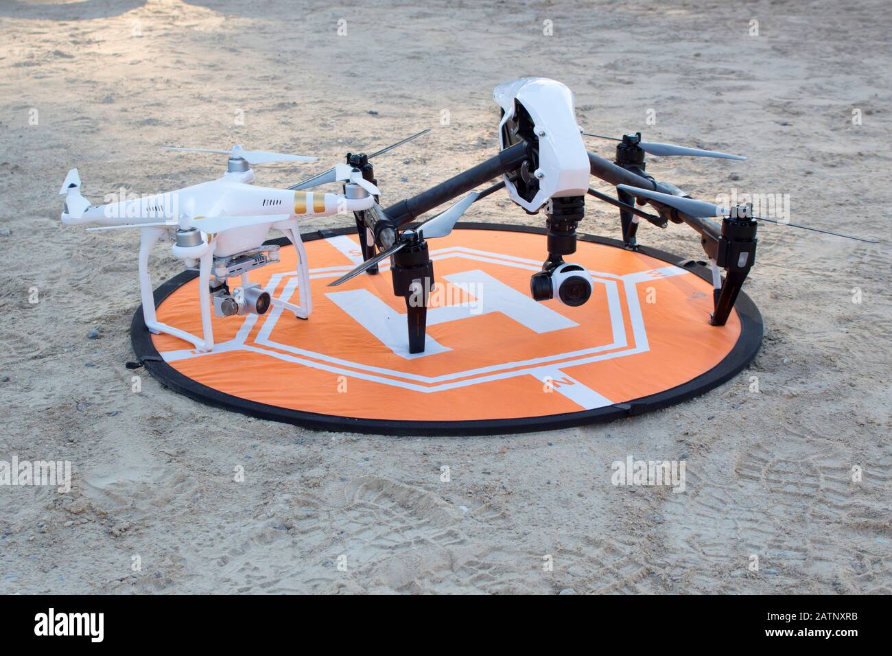 Two drones on a landing strip on the ground Stock Photo - Alamy