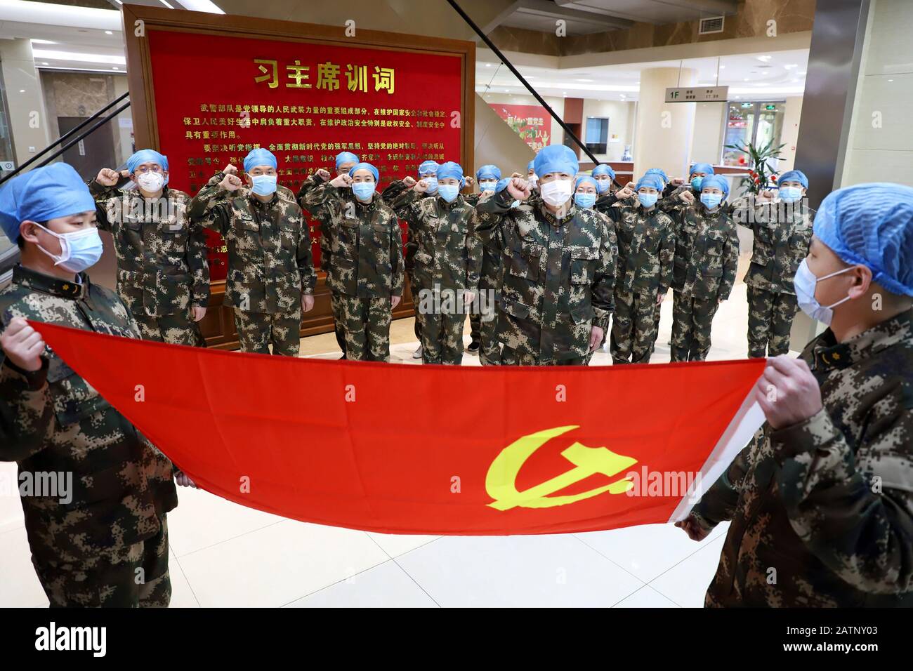 Chinese medical workers and party members swear in to fight against the ...