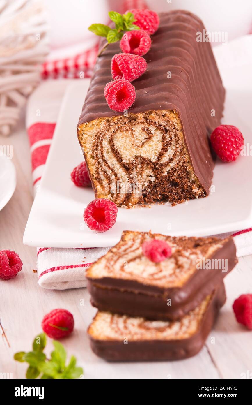 Marble cake with raspberries Stock Photo - Alamy