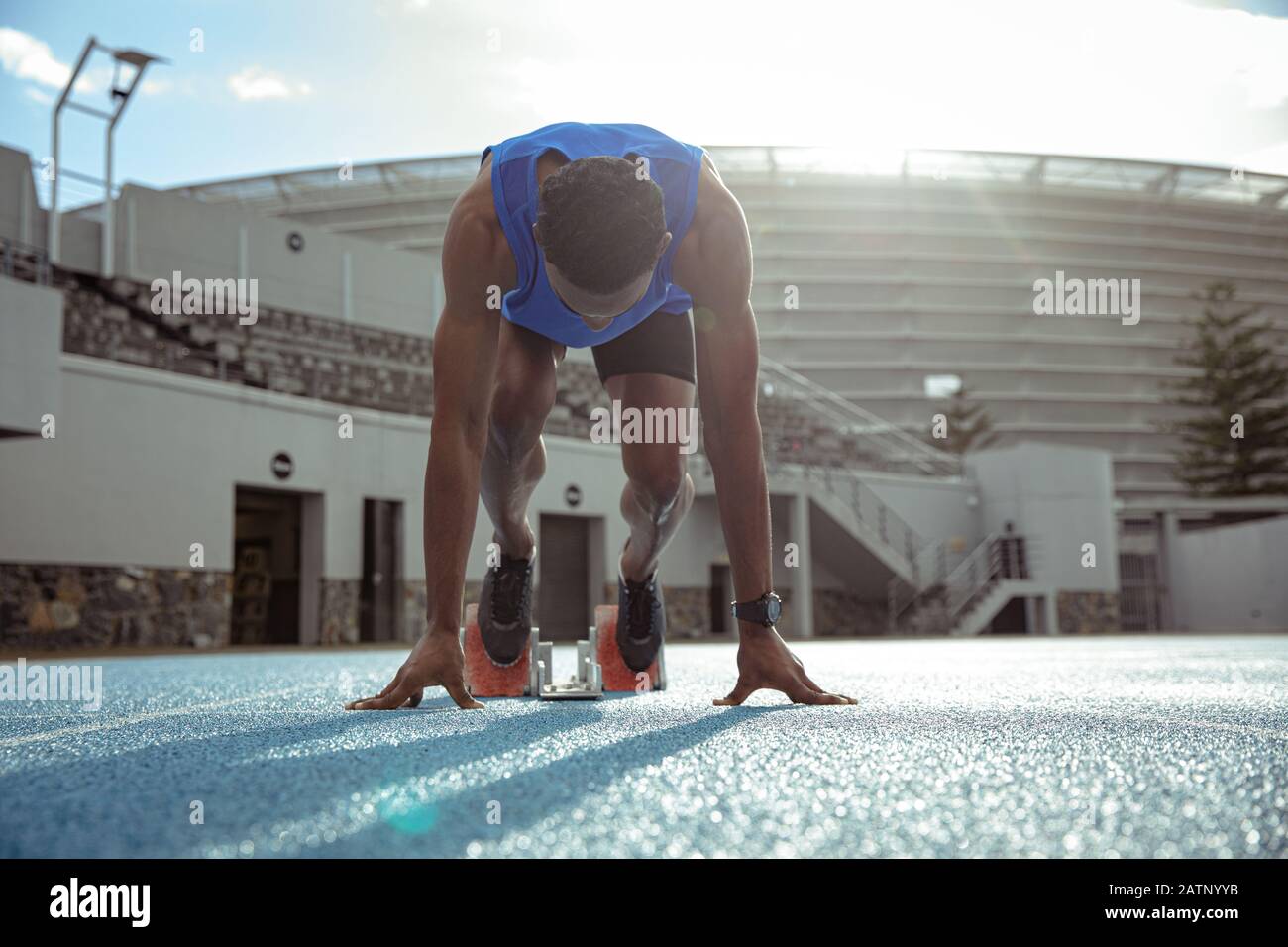 Athlete waiting for the start to run Stock Photo - Alamy