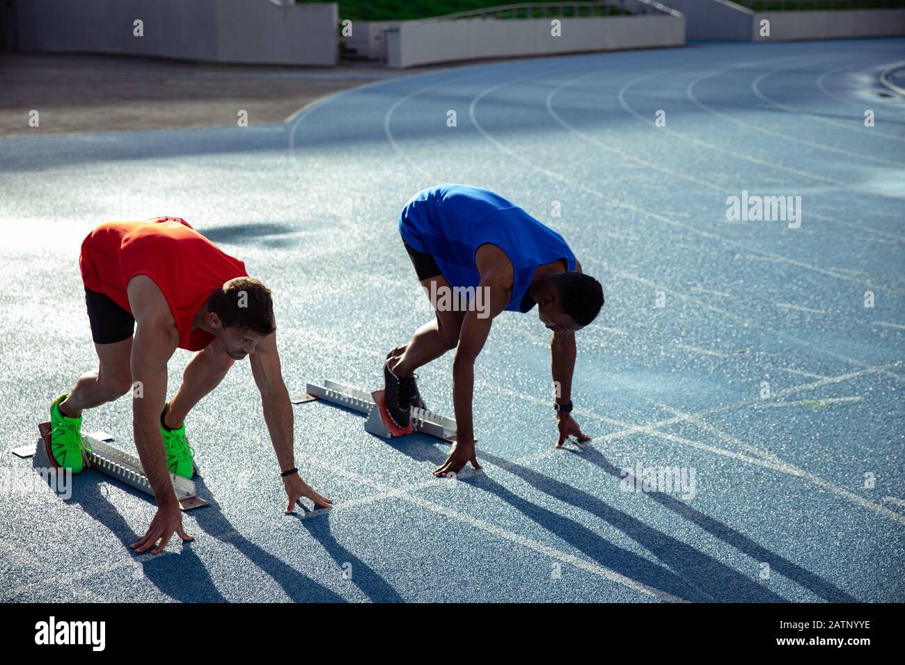 Athletes waiting for the start to run Stock Photo - Alamy