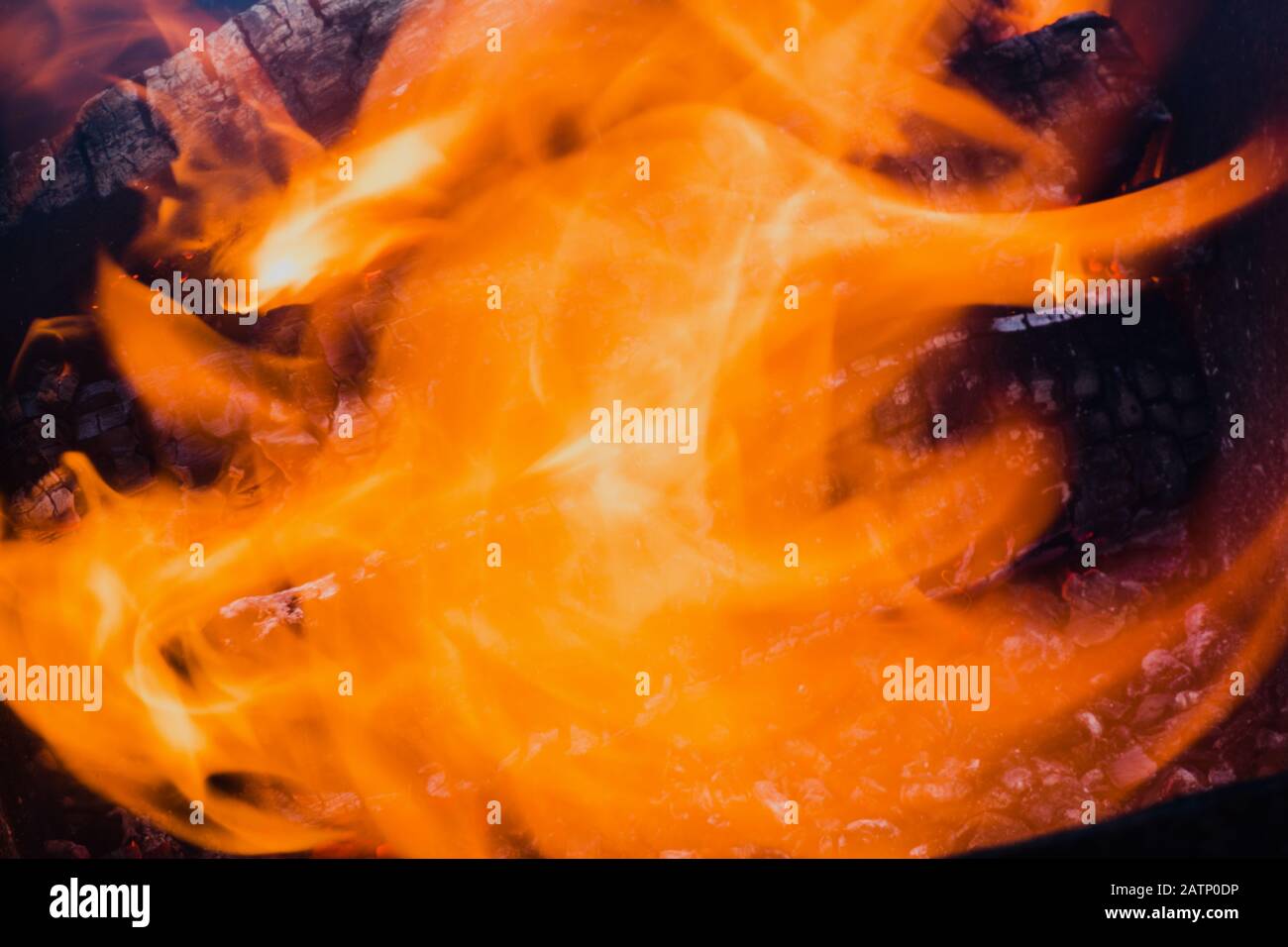 Background from the fire burns in the barbecue barbeque Stock Photo - Alamy