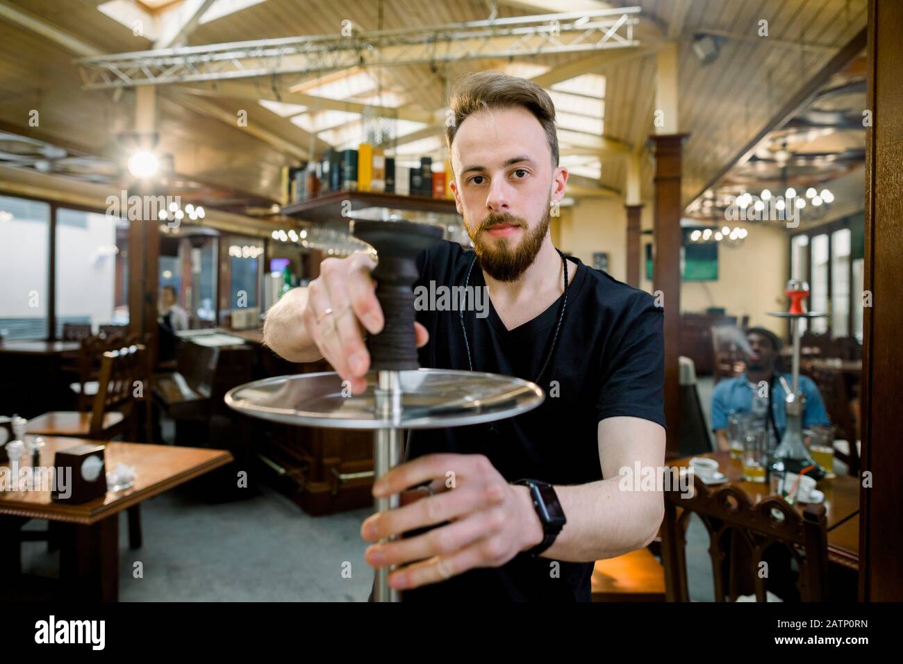 Hookah Server Waiter Prepares A Shisha Pipe For Smoking Stock Photo - Alamy