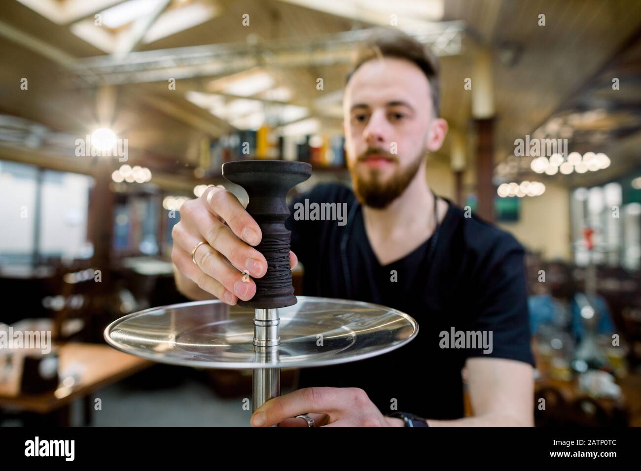 Hookah Server Waiter Prepares A Shisha Pipe For Smoking Stock Photo - Alamy