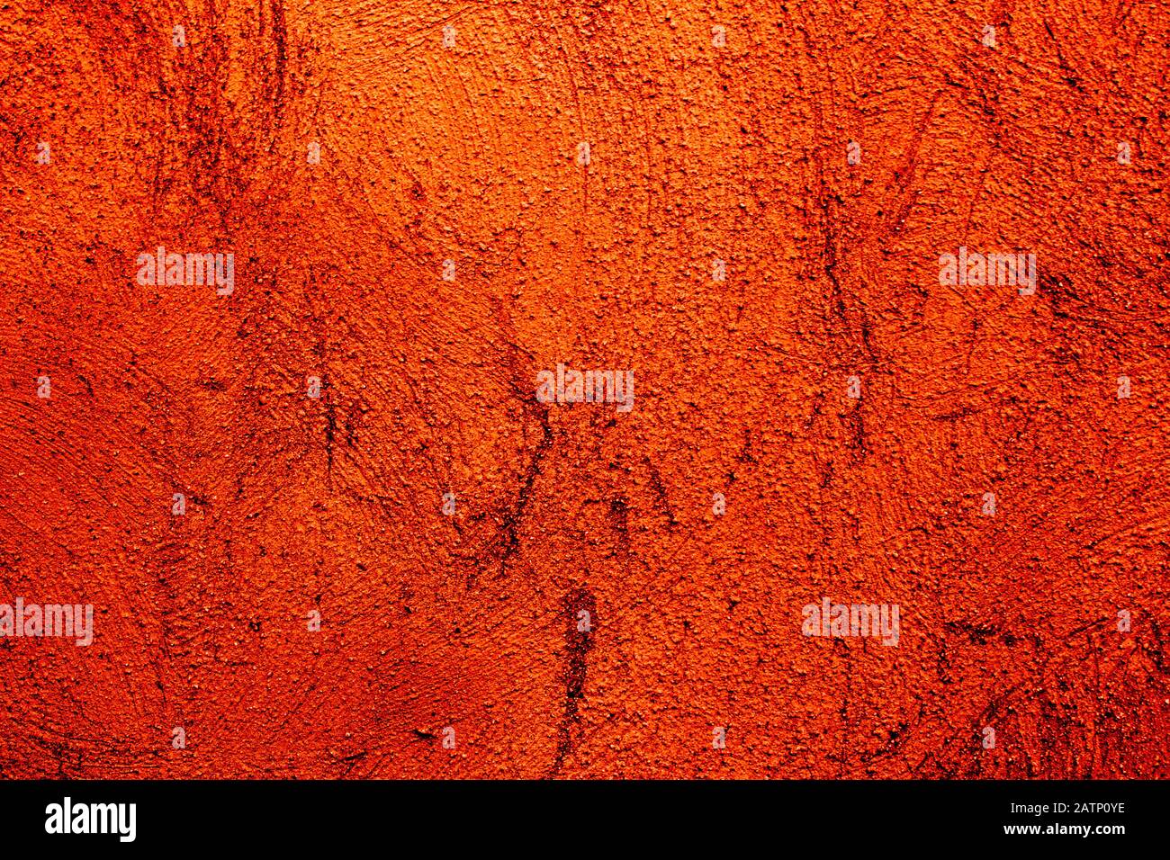 Orange colored abstract wall background with textures of different ...