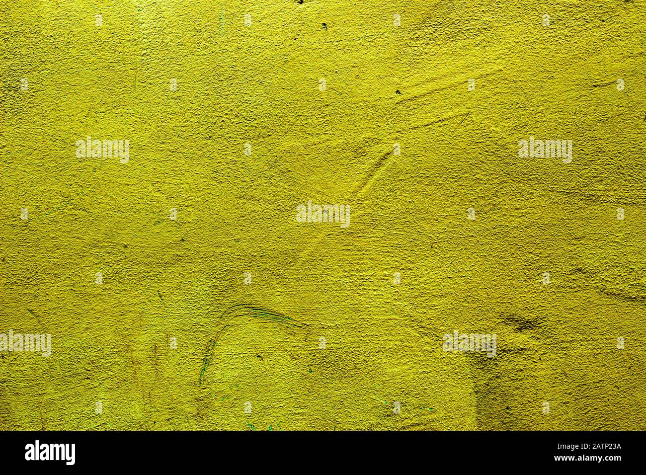 Yellow colored abstract wall background with textures of different ...