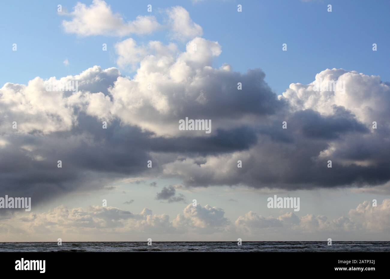 Cloud rising over dunes Stock Photo - Alamy