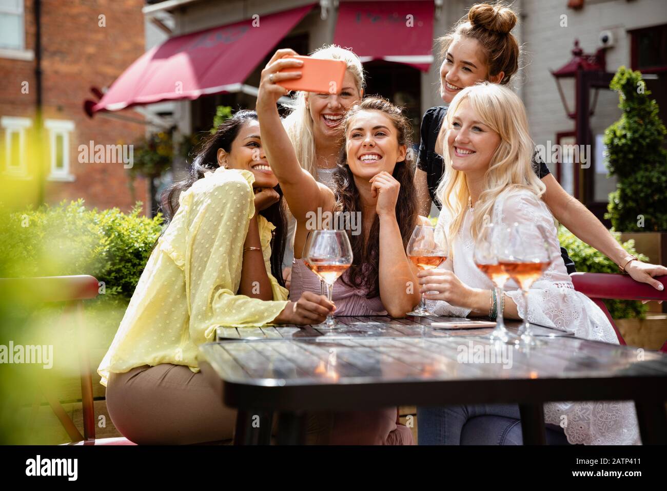 Group of women taking a selfie in a bar hi-res stock photography and ...