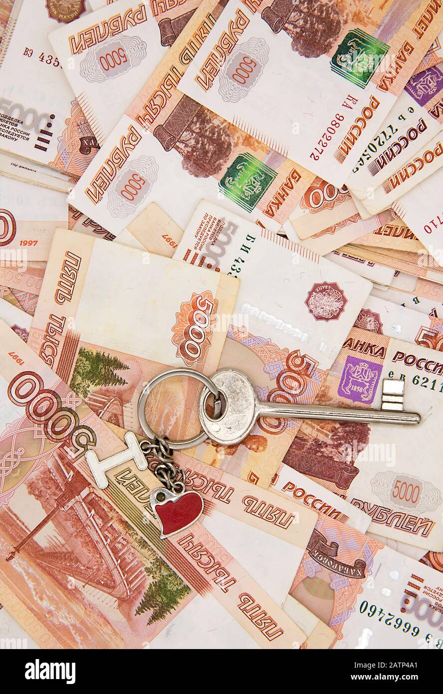 A metal key on a pile of five-thousand-ruble notes Stock Photo - Alamy
