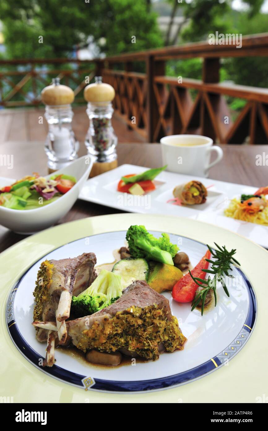 The portrait of food meal on the white plate Stock Photo - Alamy