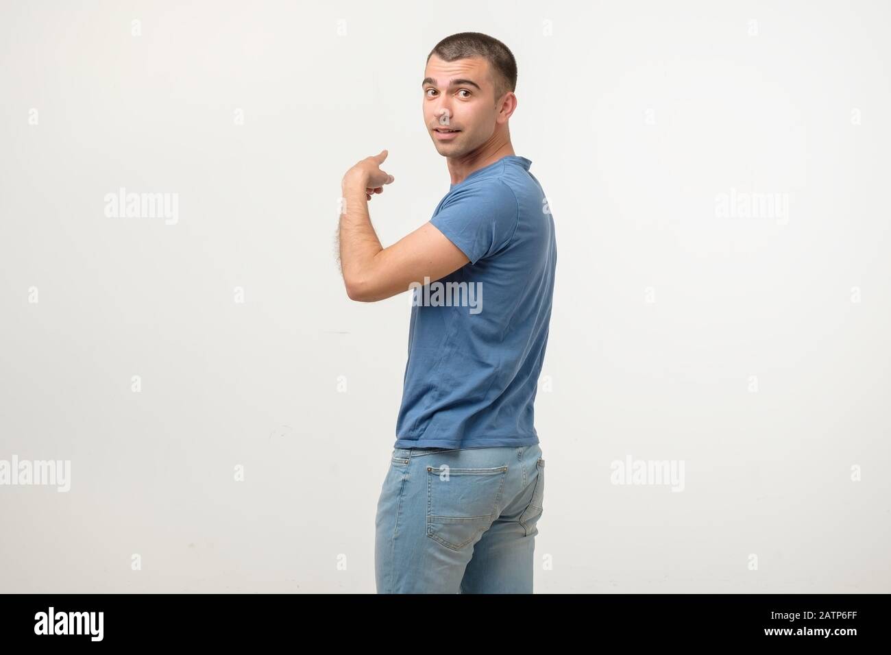 Man pointing back shocked hi-res stock photography and images - Alamy
