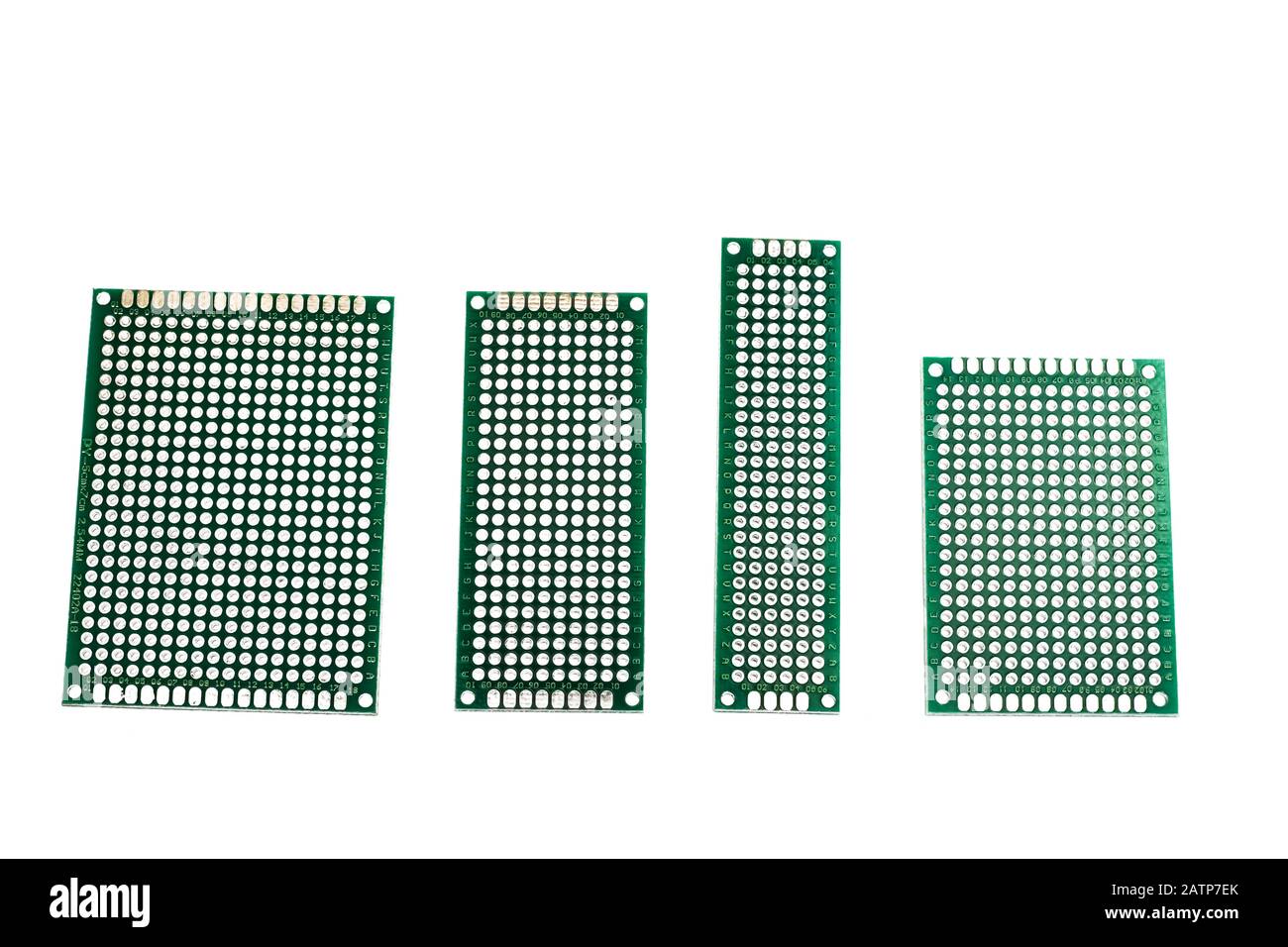 Green prototyping board in a row isolated on white background Stock Photo - Alamy