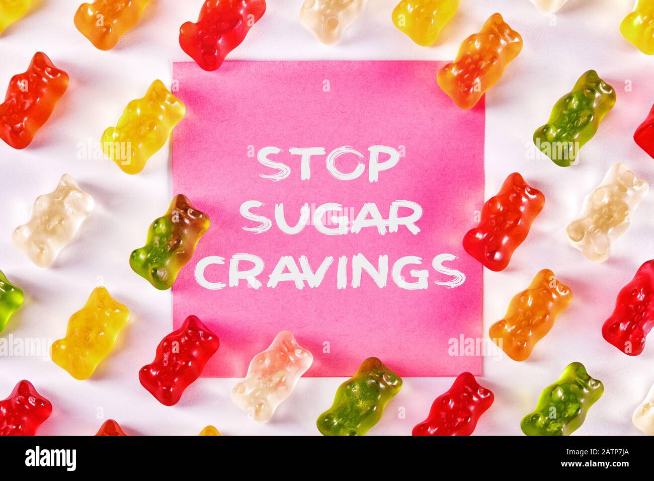 Gummy bear candies with a note paper stop sugar cravings written on it ...