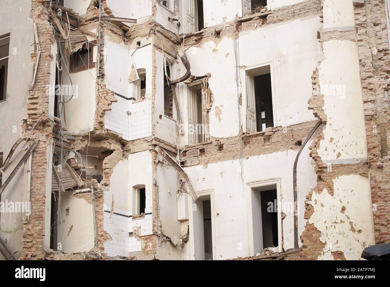 Old demolished multistory building with bricks and doorframes ...