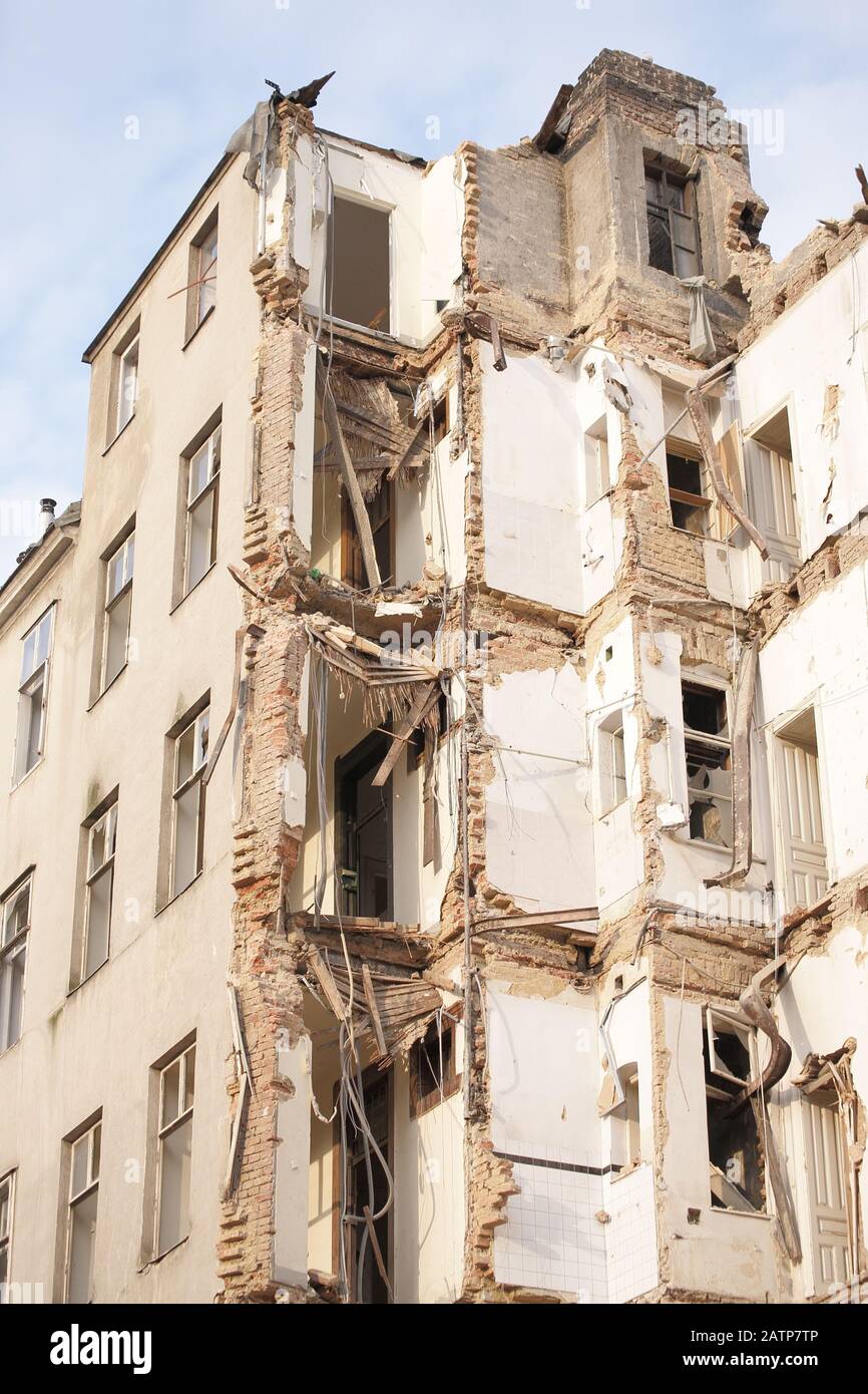 Demolished multistory building with sky, low-angle shot. demolition ...