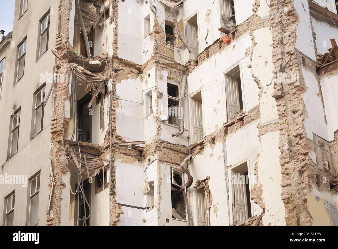 Old demolished multistory building with bricks and doorframes ...