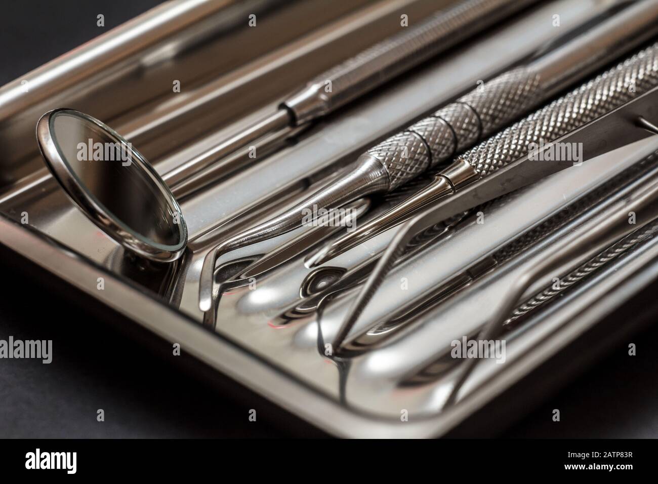 Set of dental instruments for dental treatment. Medical tools in ...